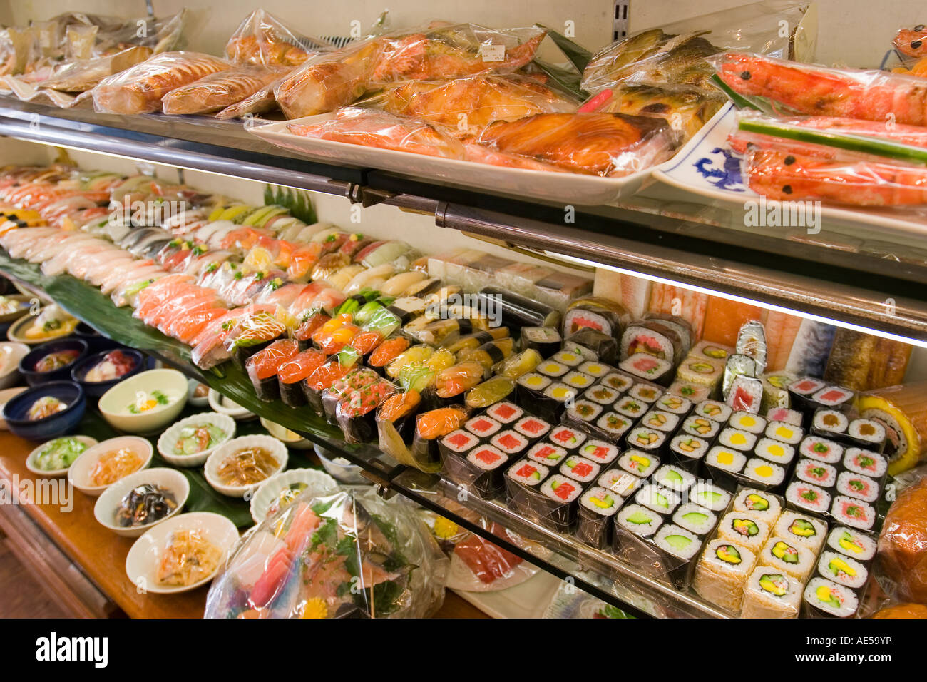Fake sushi and bowls of Japanese foods on display in a store selling ...