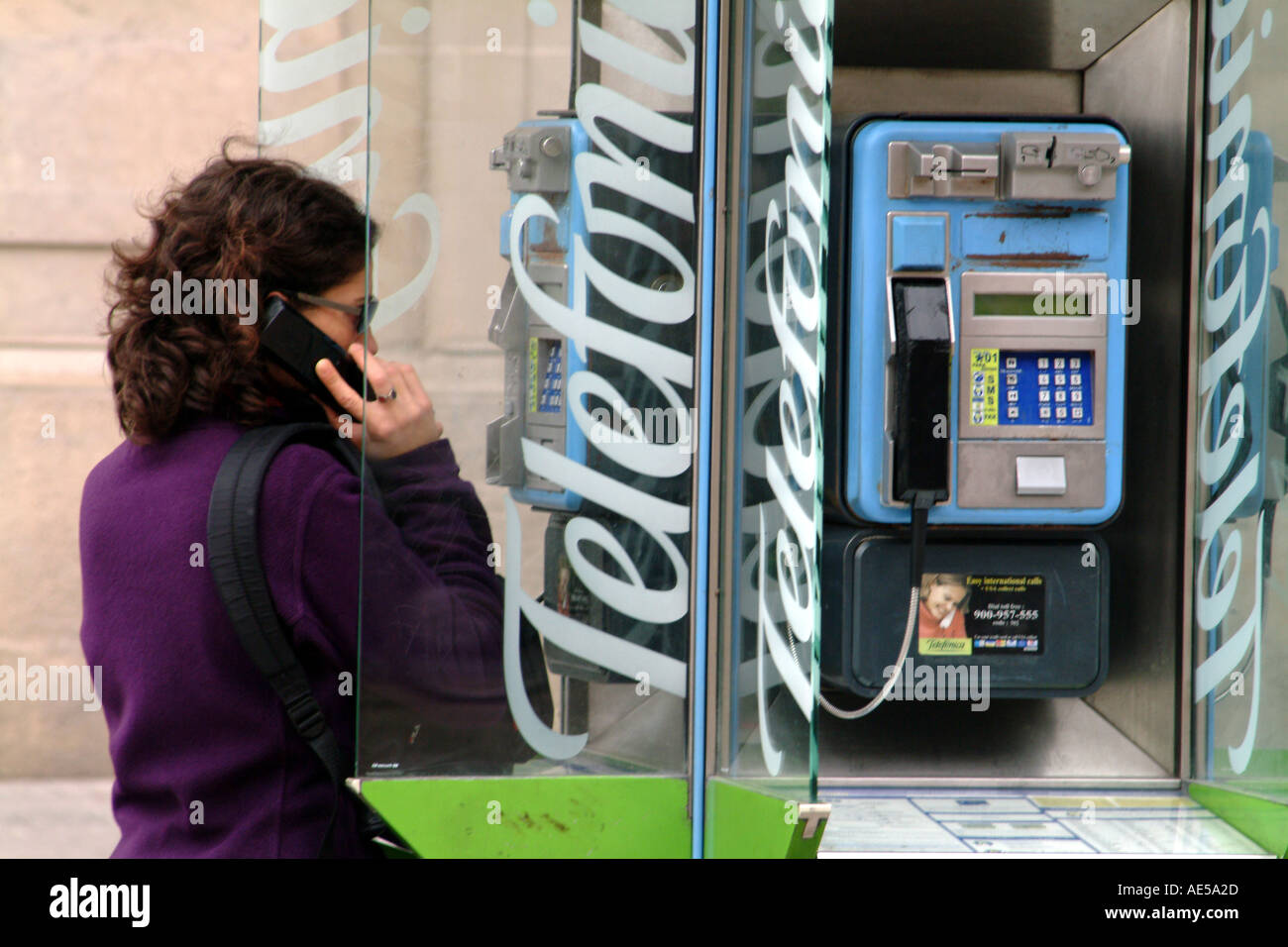 Barcelona Spain Public Telephone woman speaking Stock Photo - Alamy