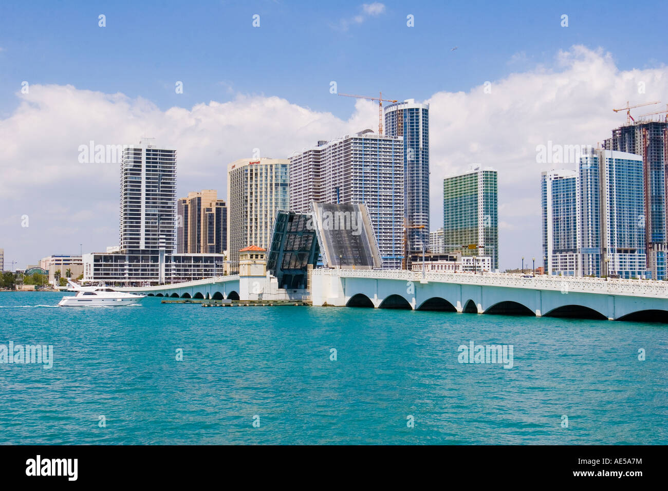 Yacht in Biscayne Bay approaching raised drawbridge of Venetian Way ...