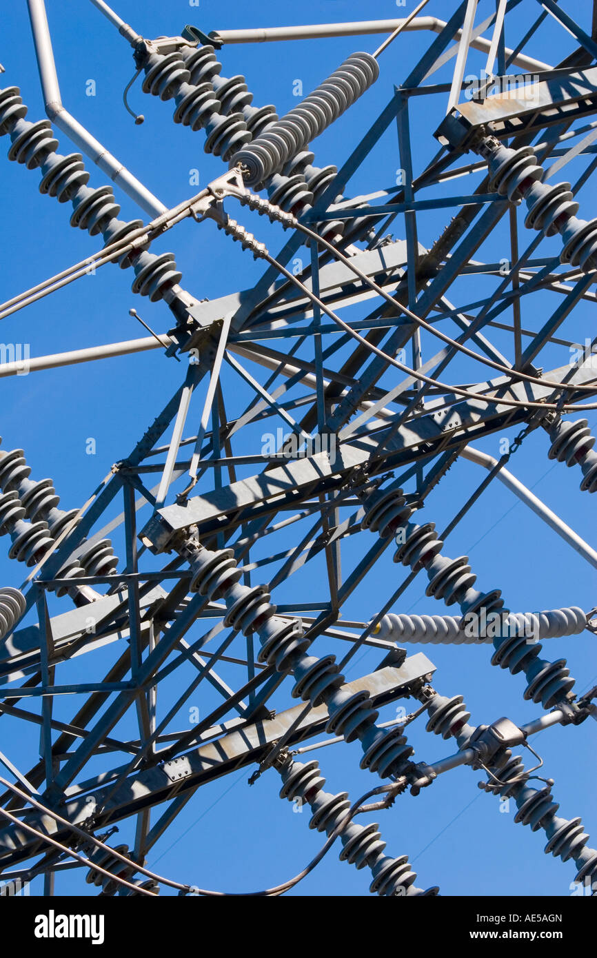 Closeup of high voltage insulators at an electrical power plant ...