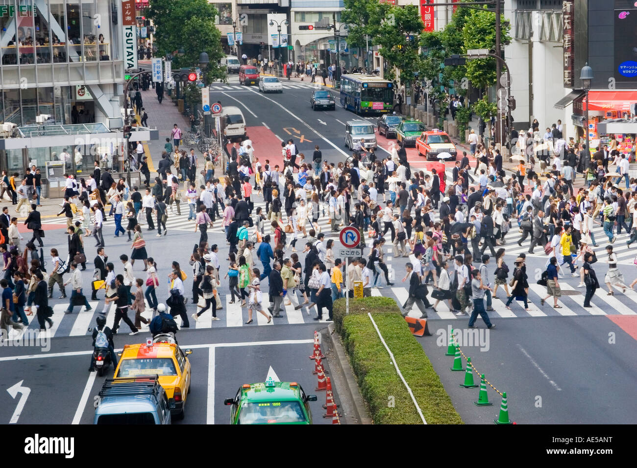 Crowd of Japanese pedestrians crossing the street at the crosswalks at ...