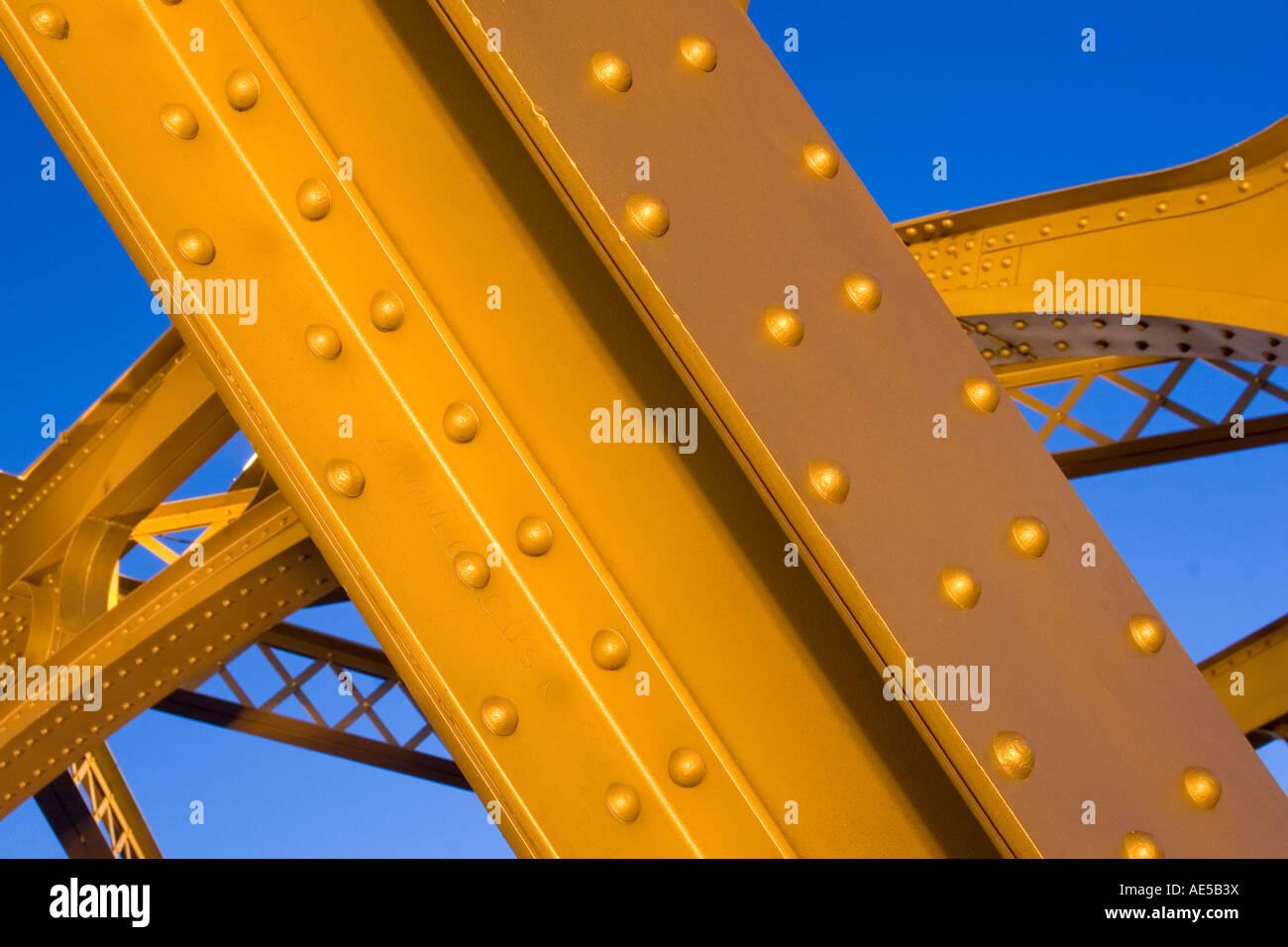 Abstract closeup of girders and metal beams of Tower Bridge against a ...