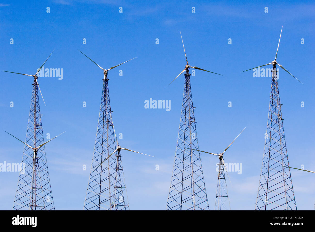 A group of windmill towers against a deep blue sky Livermore California ...