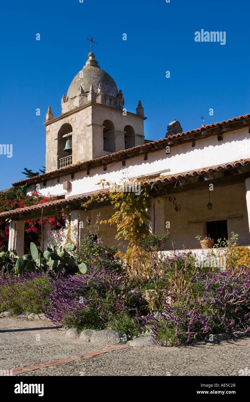 Lavender and shrubs line courtyard portico at the Carmel Mission with ...