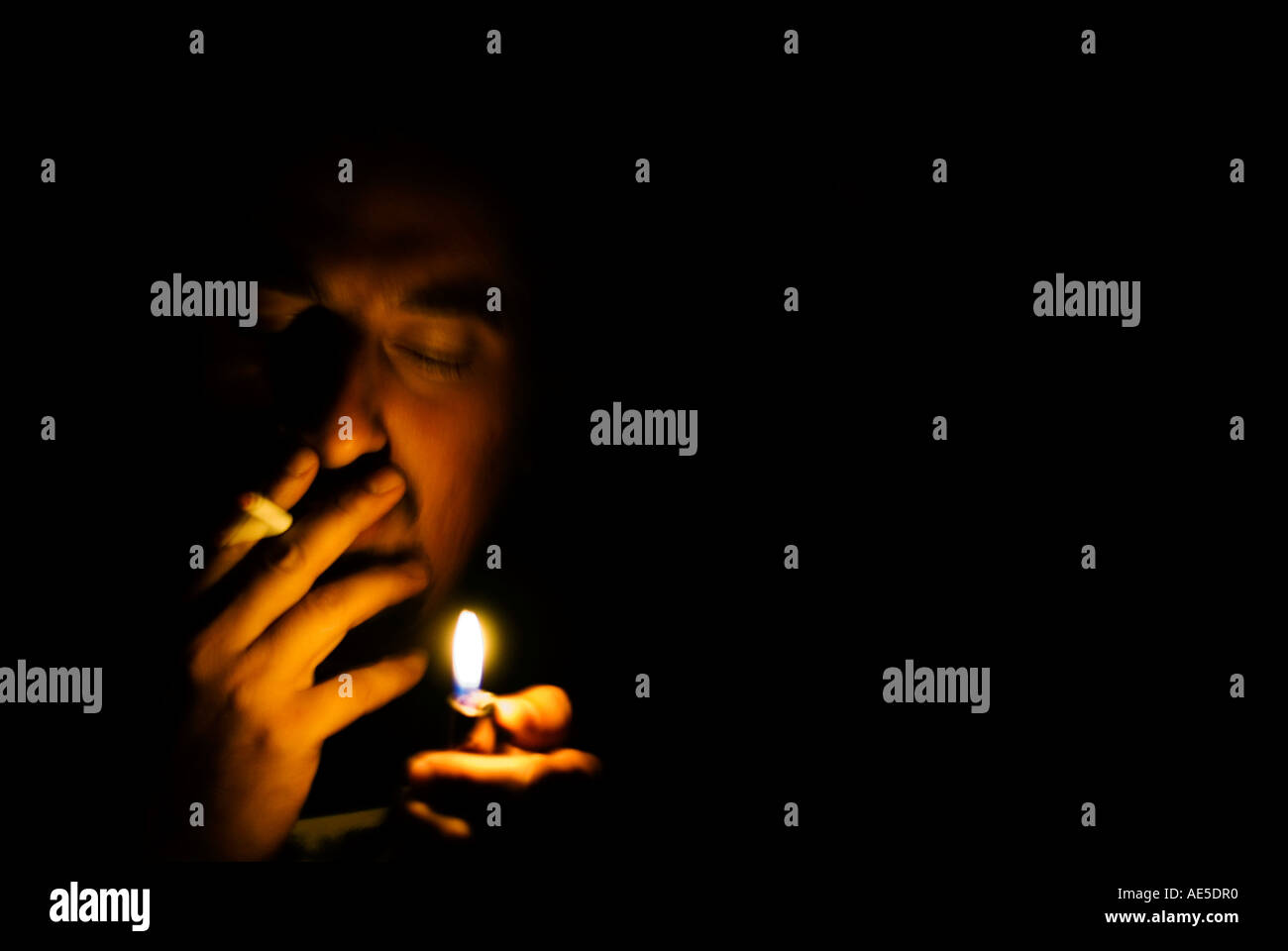 Man smoking in shadows hi-res stock photography and images - Alamy