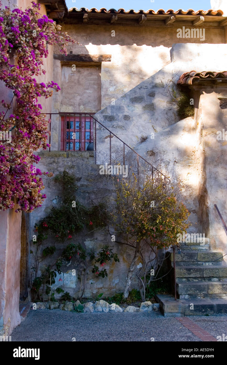 Spanish style architecture of mission courtyard with stucco walls wood ...