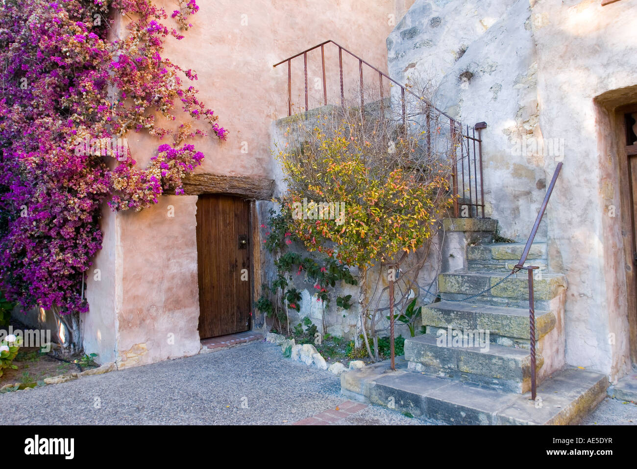 Spanish style architecture of mission courtyard with stucco walls wood ...