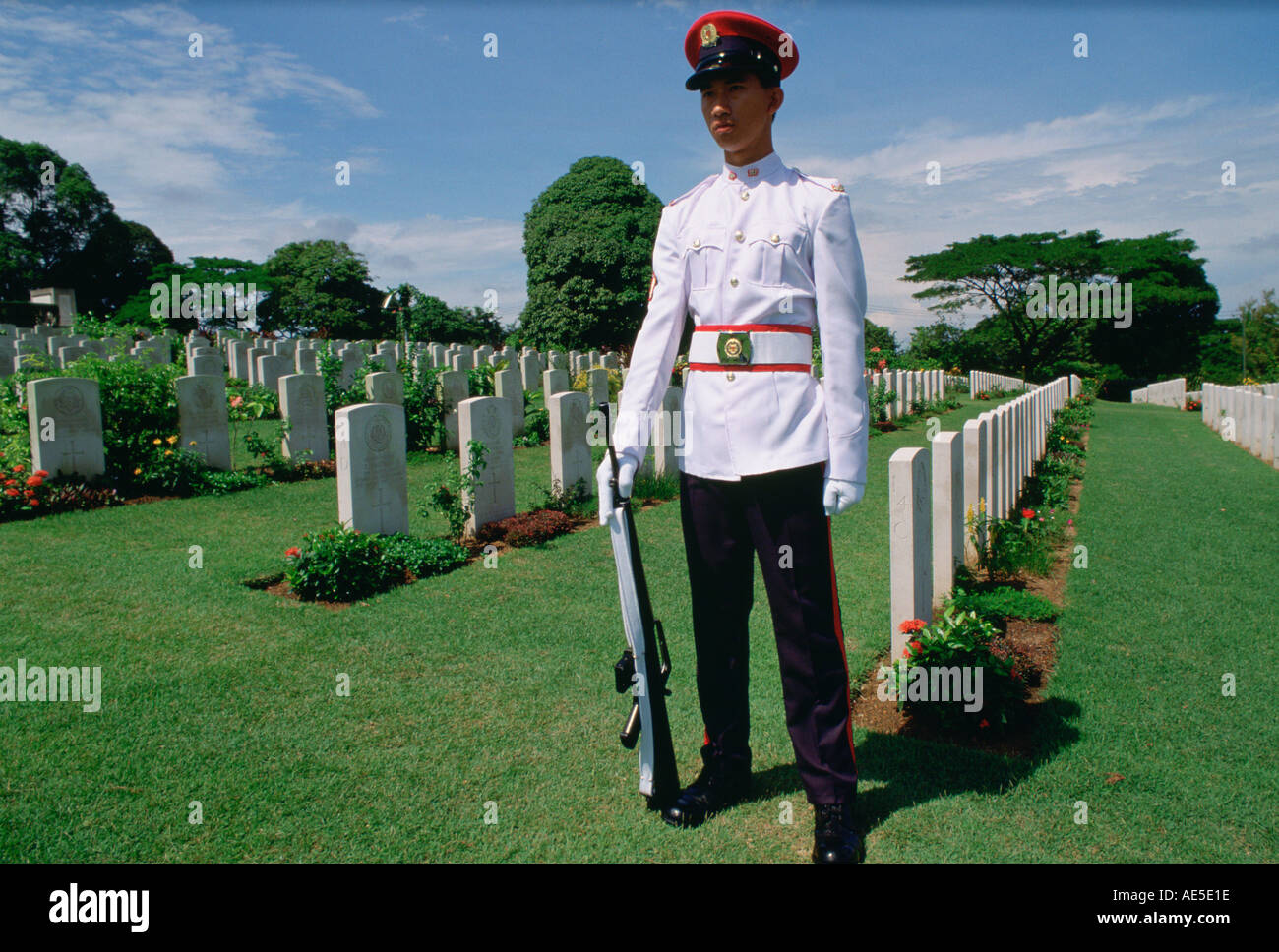 Soldier standing on guard over Commonwealth War Graves at Krangi War ...