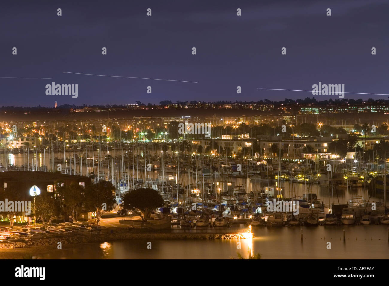 Light trails from three airplanes landing at night at Los Angeles ...