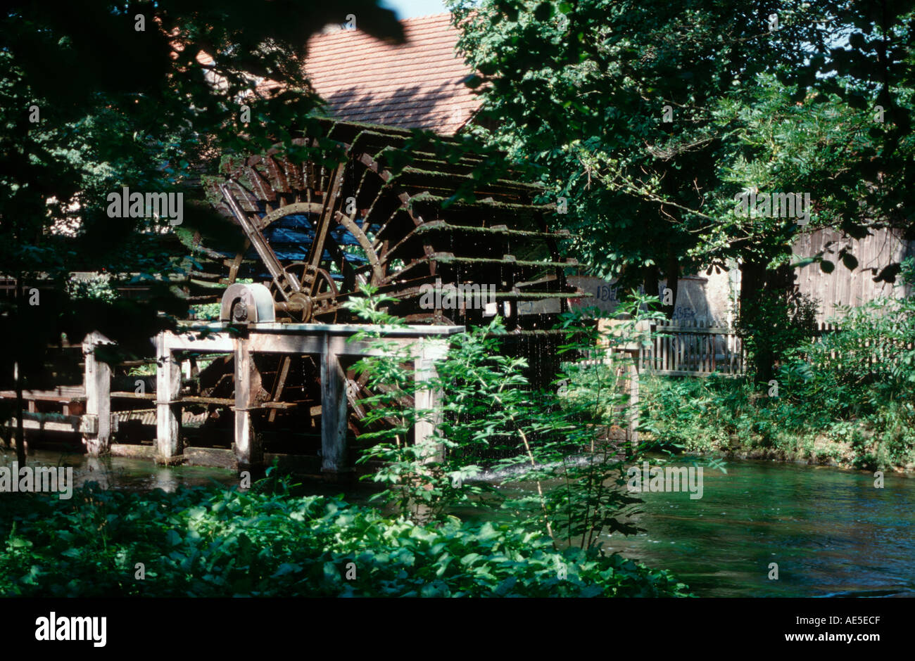 Old paper mill wheel at the river Wuerm in Gauting near Munich Bavaria ...