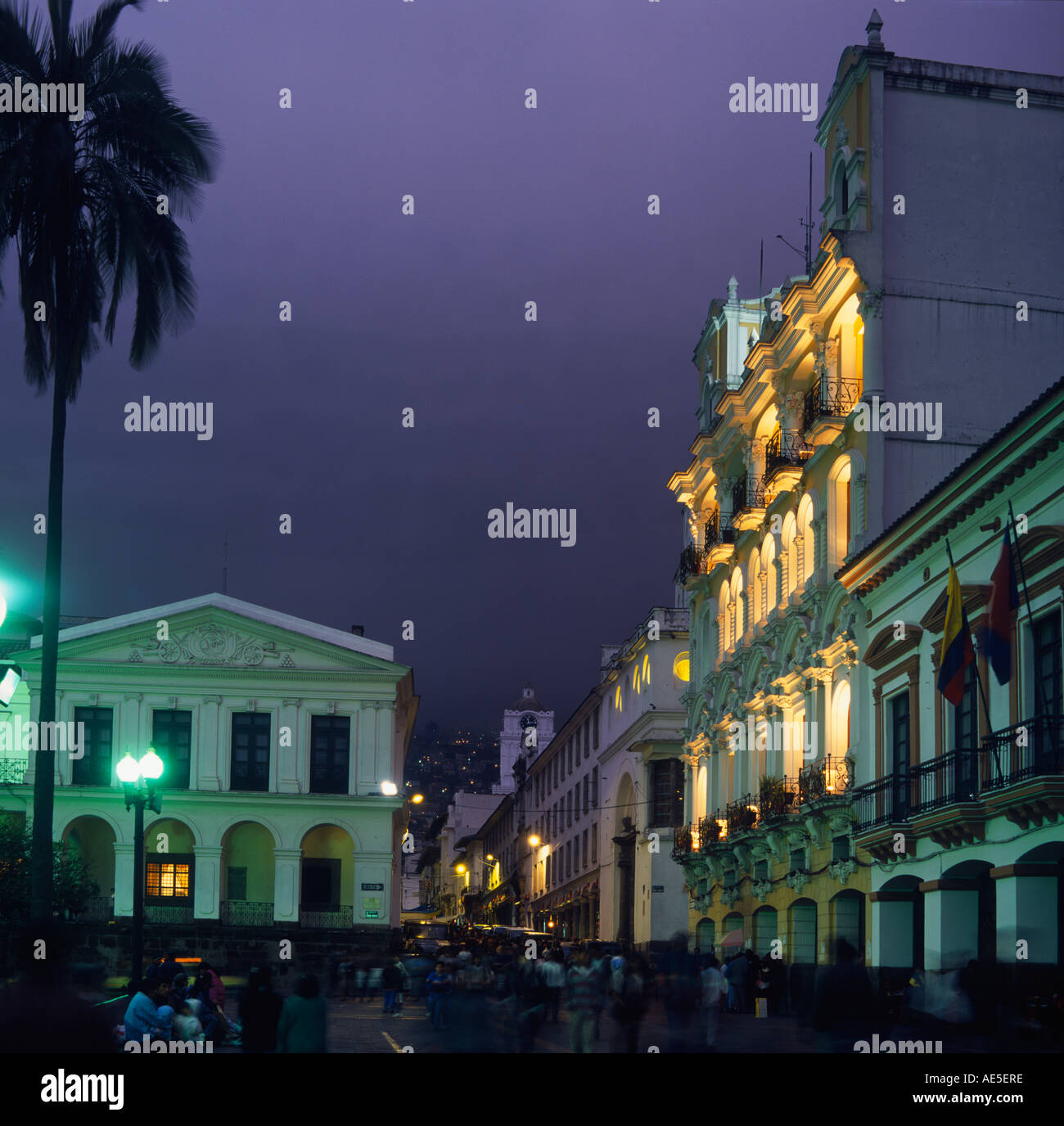 People in Independence Square and colonial buildings lit at dusk with ...