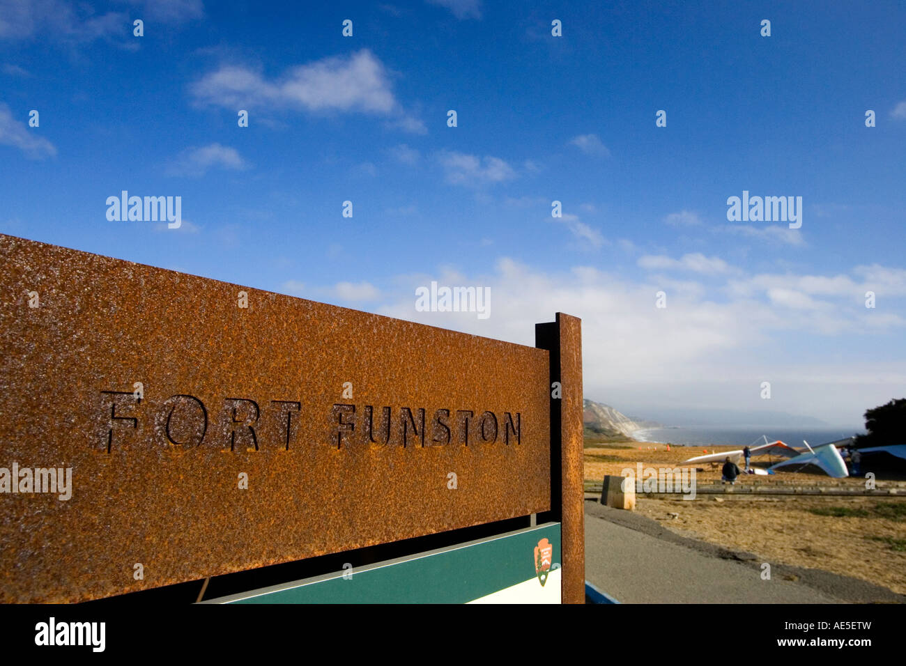 Fort Funston sign with hang gliders and the California coastline in the ...
