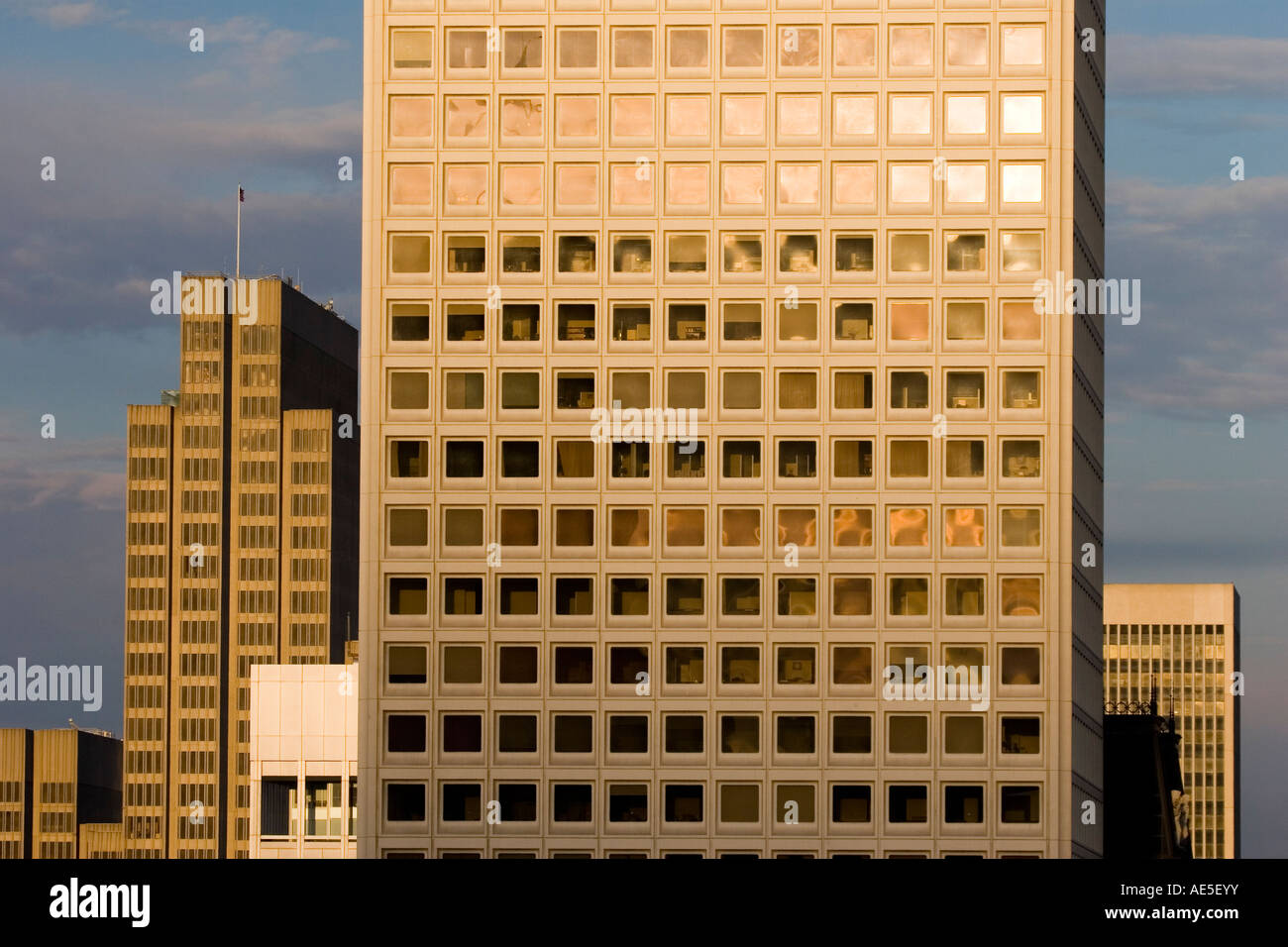 Modern architecture of skyscraper office buildings glowing in the late ...