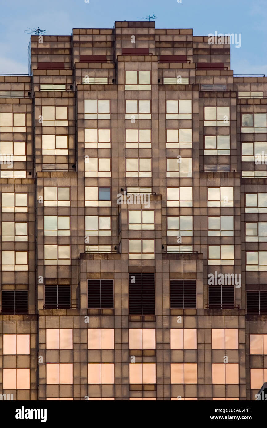 Sun reflecting off windows of tall office building in commercial ...