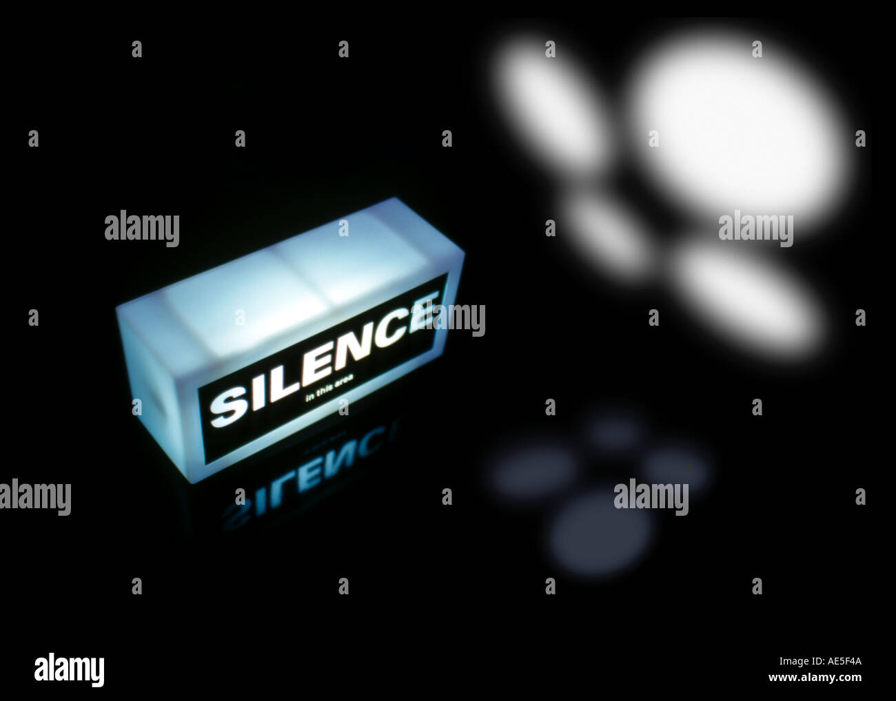 silence light box on black reflective background Stock Photo - Alamy