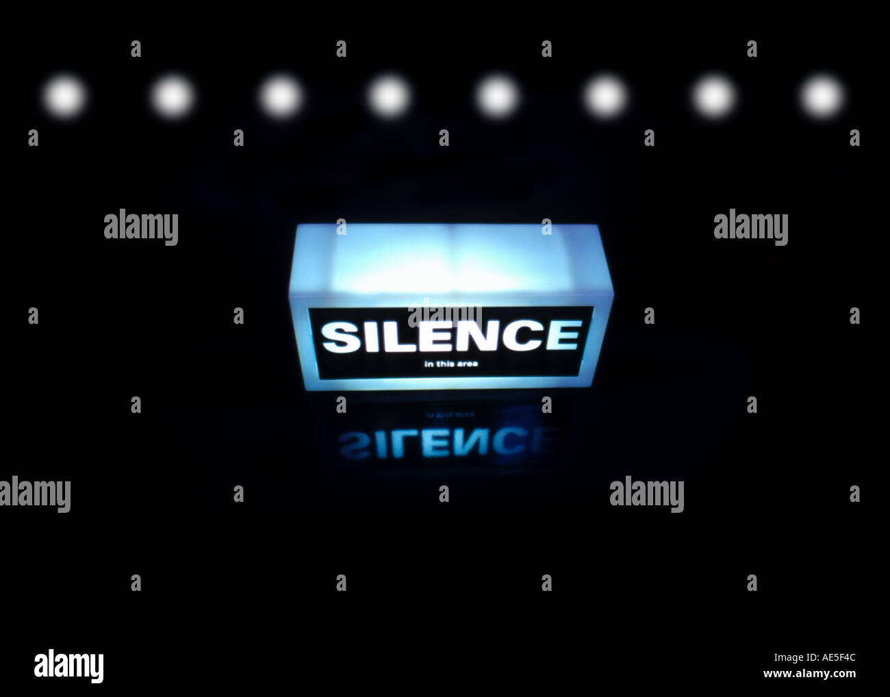 silence light box on black reflective background Stock Photo - Alamy