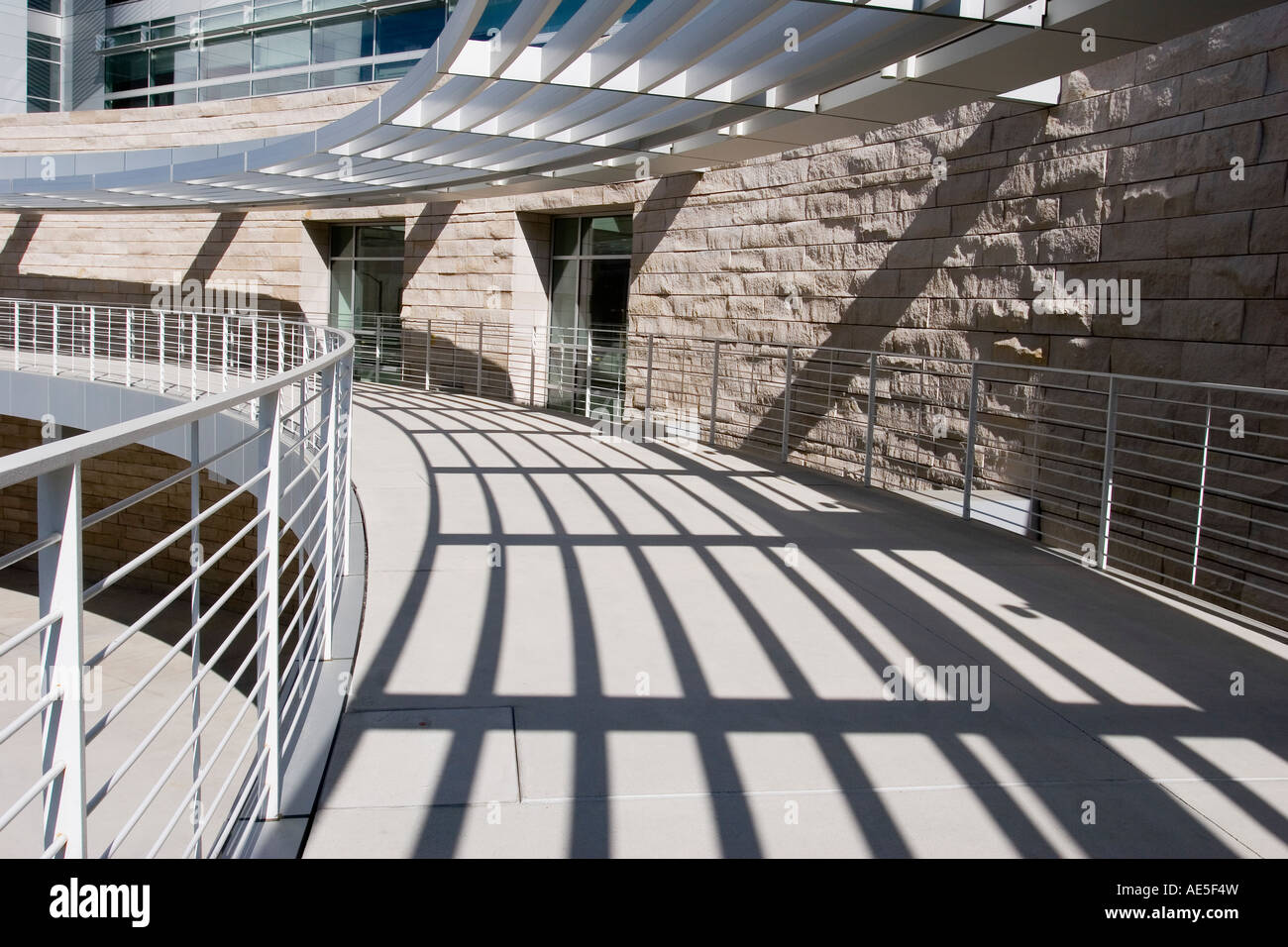 Curved pathway along outside of San Jose City Hall office building with ...