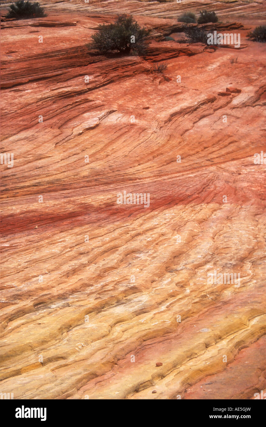 Plateau of orange red rock formations in striated rippled pattern ...