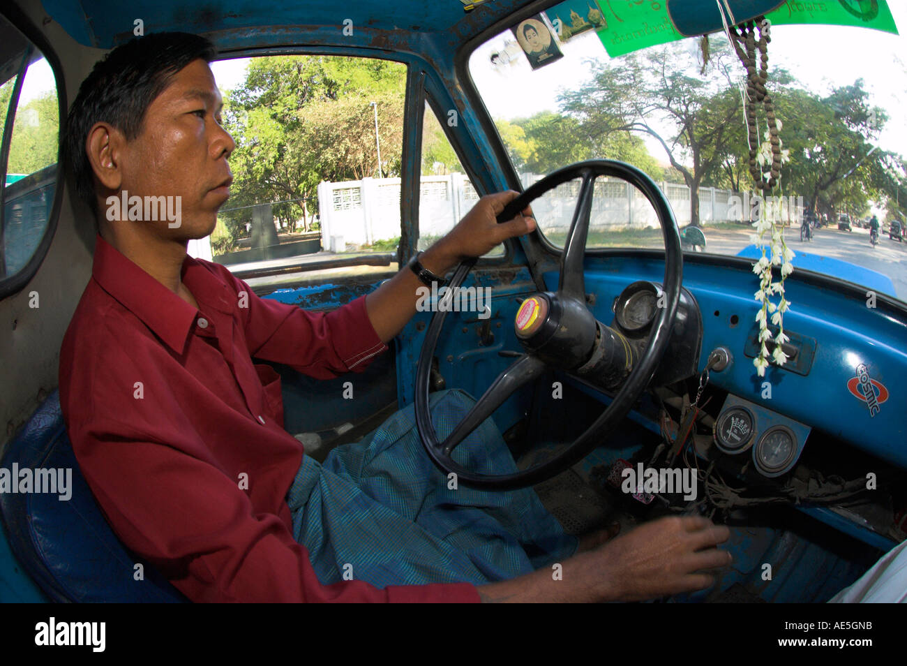Myanmar Burma Mandalay Burmeese taxi taxi driver behind steering wheel ...