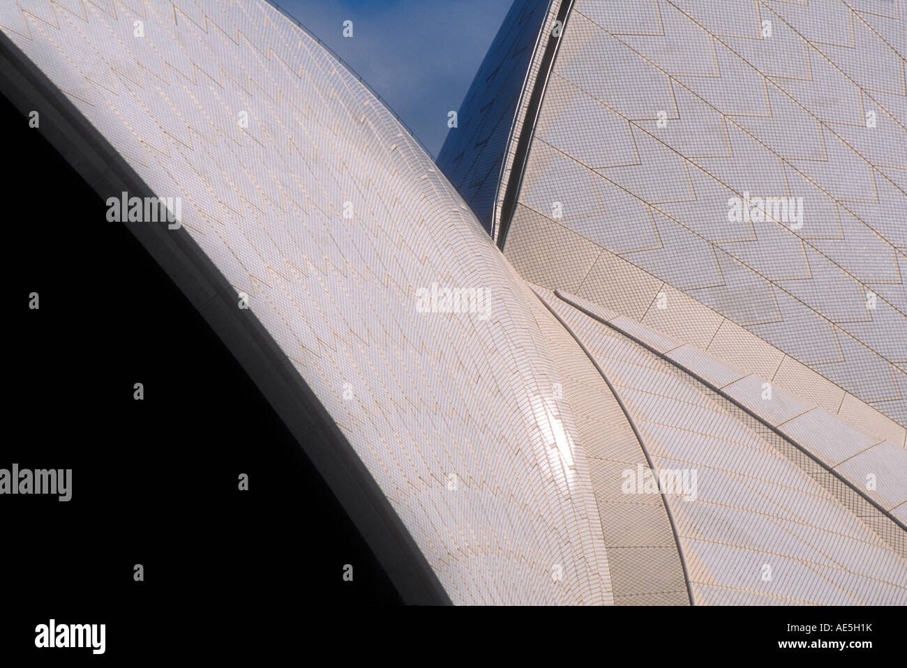 Abstract of Sydney Opera House sails showing gold and white zig zag ...