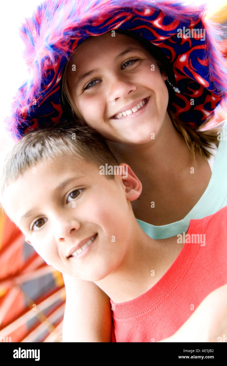 Kids wearing funky carnival hat Stock Photo - Alamy