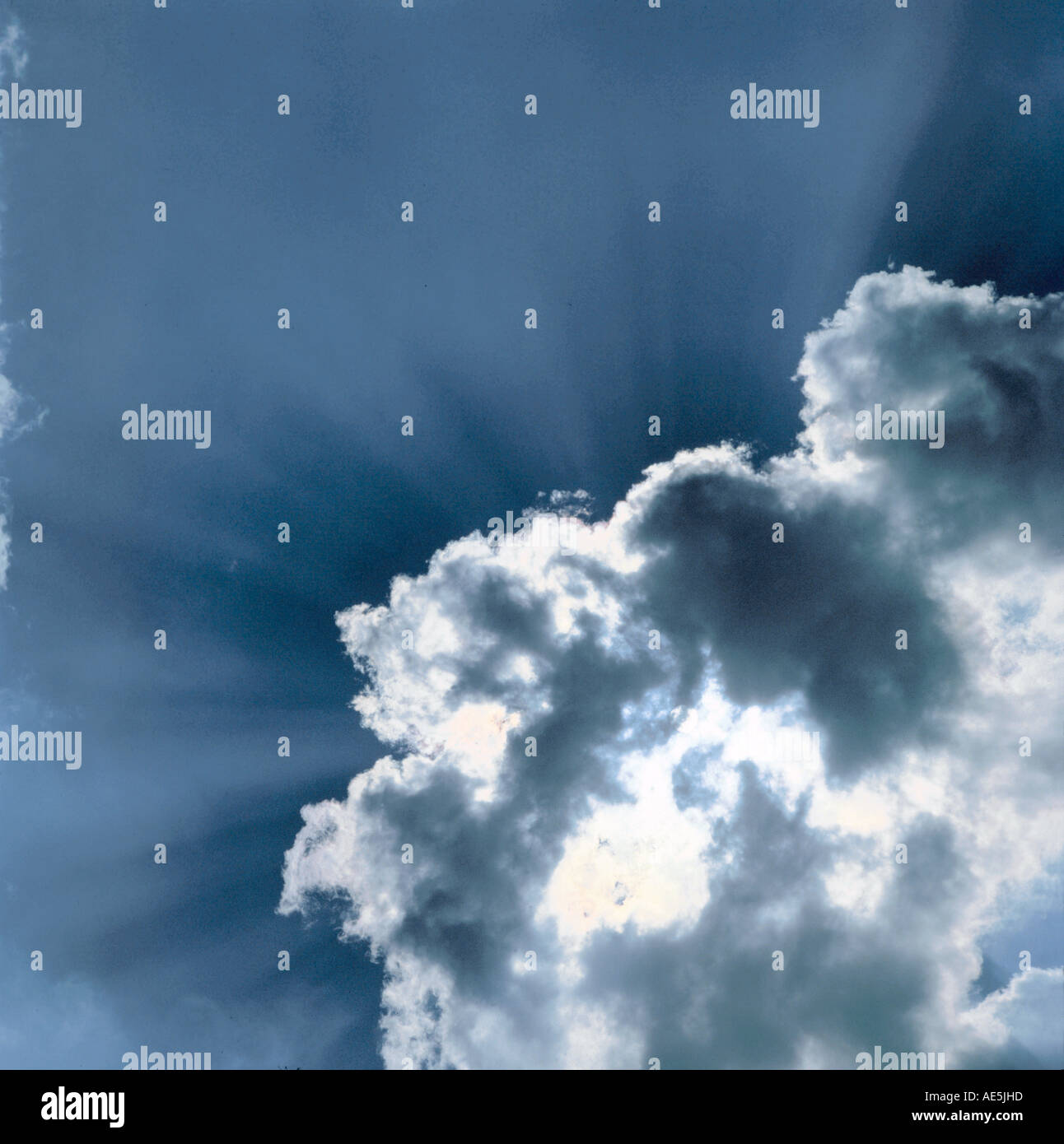 Sun behind clouds Stock Photo - Alamy