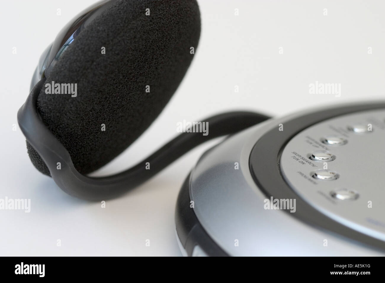 Headphones with a hi tech chrome curved MP3 player Stock Photo - Alamy