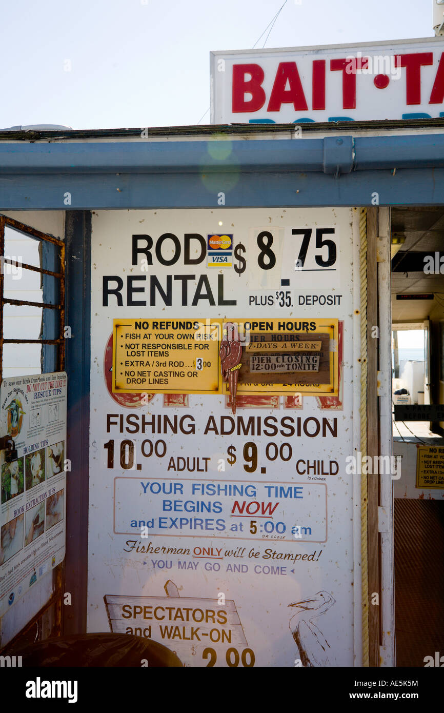 Sign at fishing pier for admission and rental prices Stock Photo - Alamy