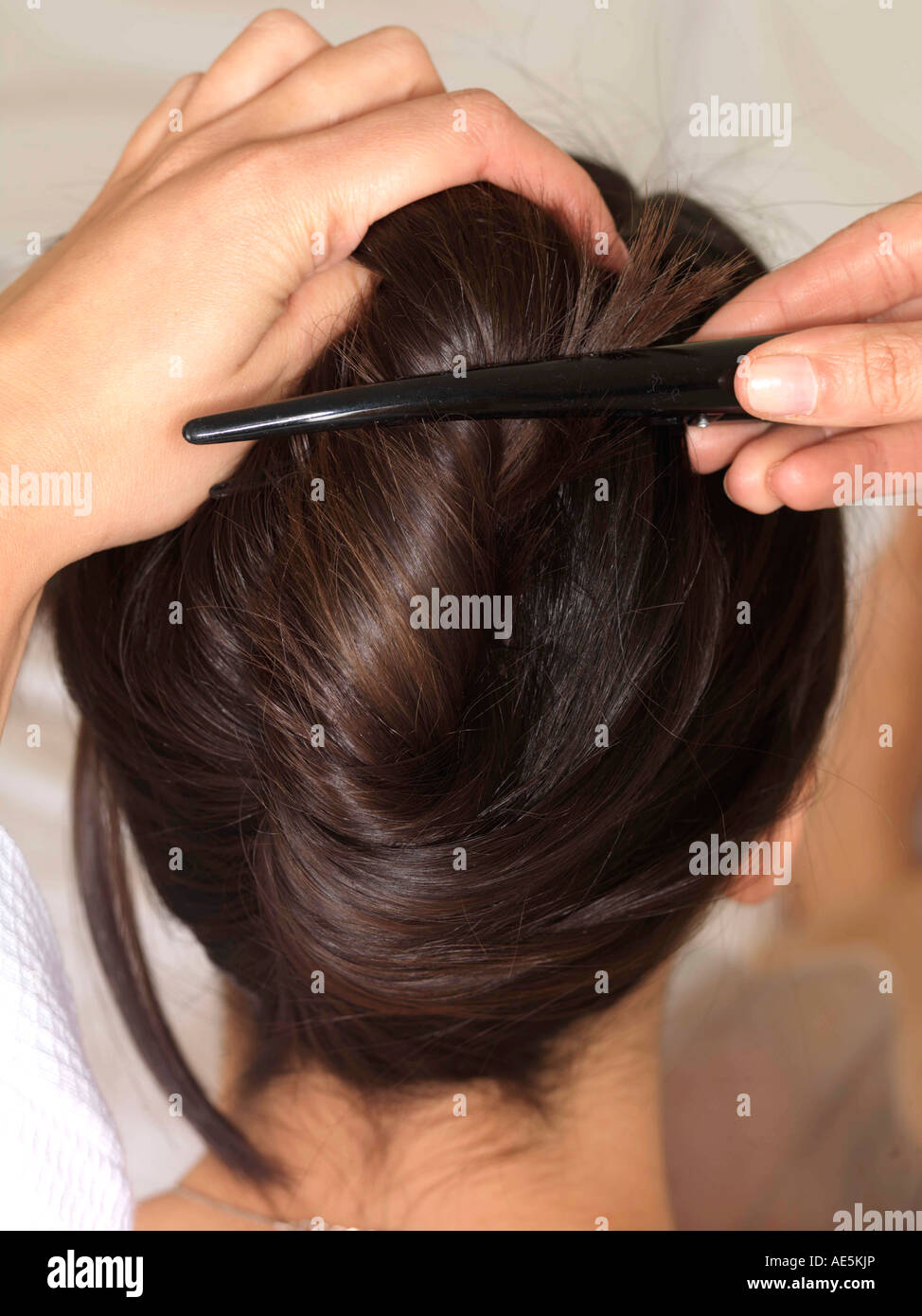 Young Women Using Hair Clip Models Released Stock Photo - Alamy