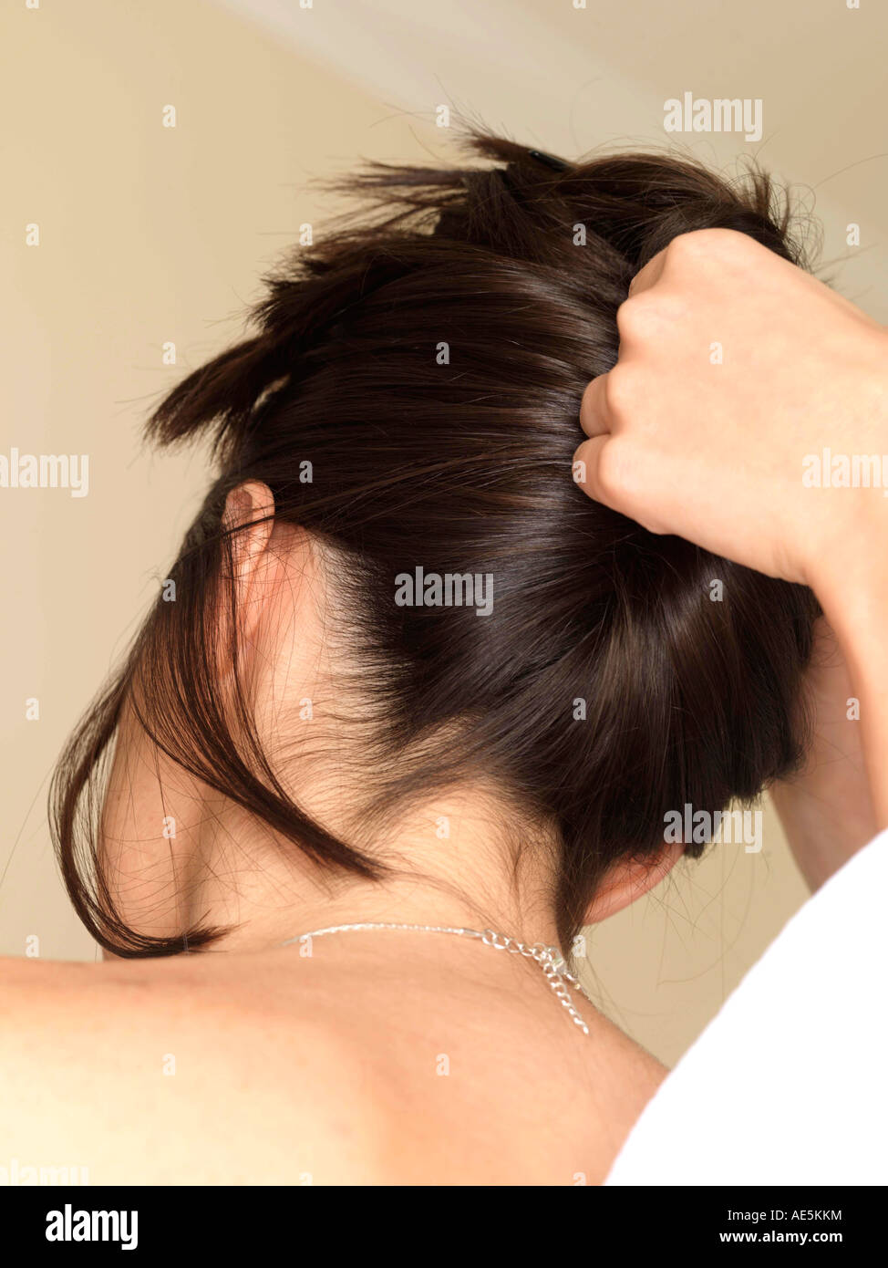 Young Women Putting Hair Up Models Released Stock Photo - Alamy