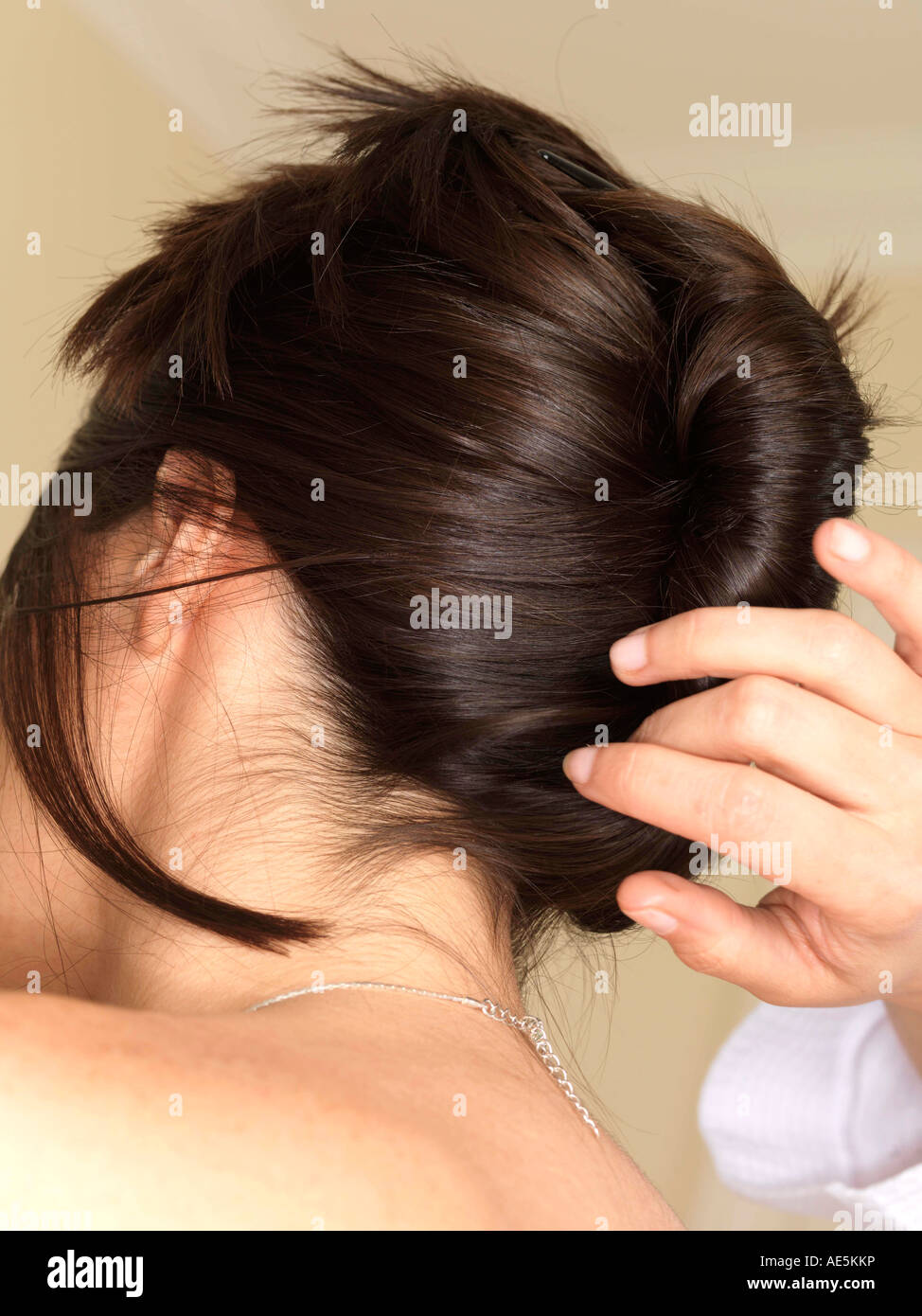 Young Women Putting Hair Up Models Released Stock Photo - Alamy