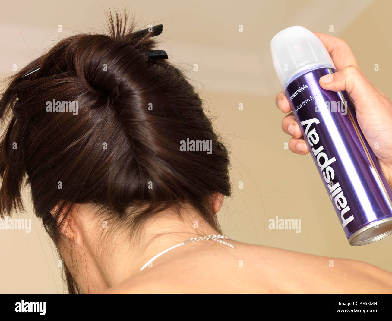 Young Women Applying Hair Spray Model Released Stock Photo - Alamy