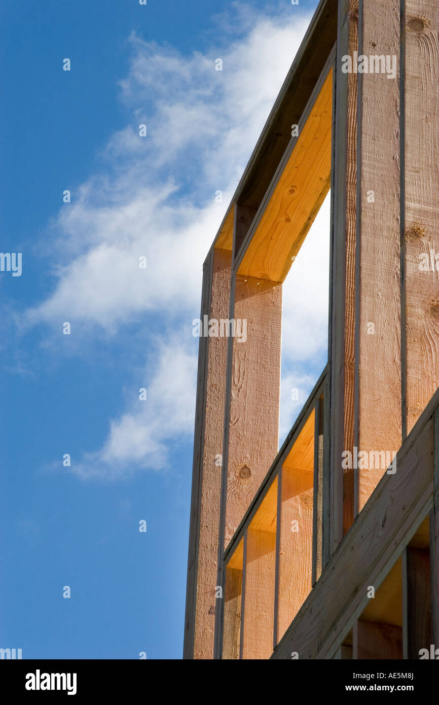 Looking up at the framing of a second story corner window to sky with ...