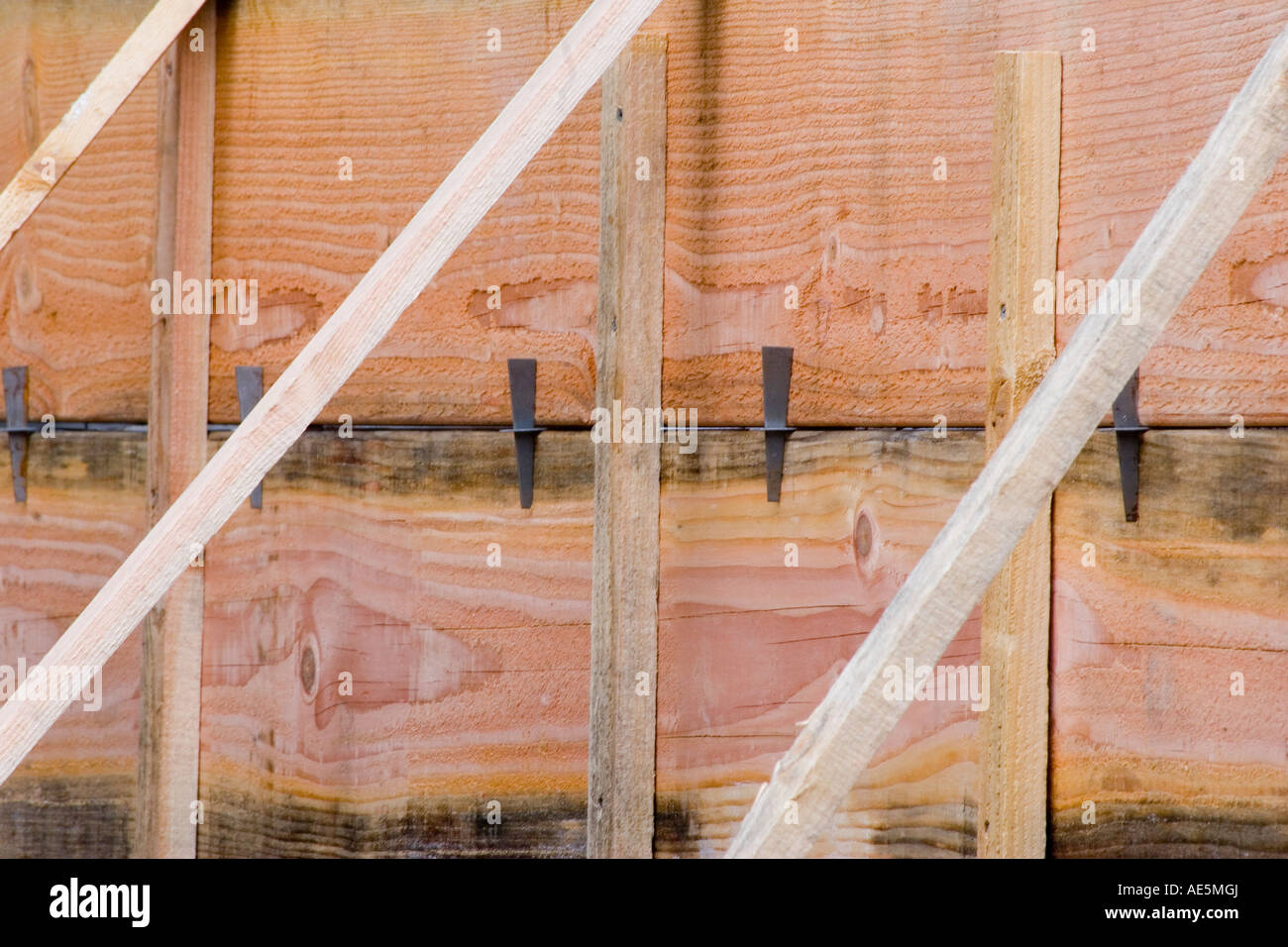 Layers of wood planks made into form wall used to pour reinforced ...