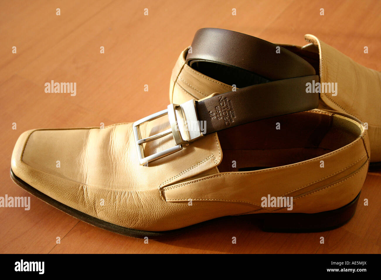 Close up leather belt and pair of dress shoes together Stock Photo - Alamy