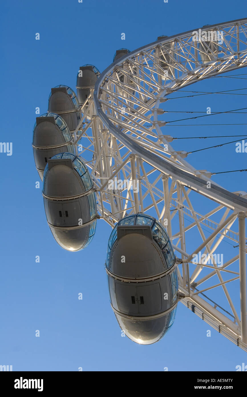 The London Eye gondolas on the curved frame with spokes as seen from ...