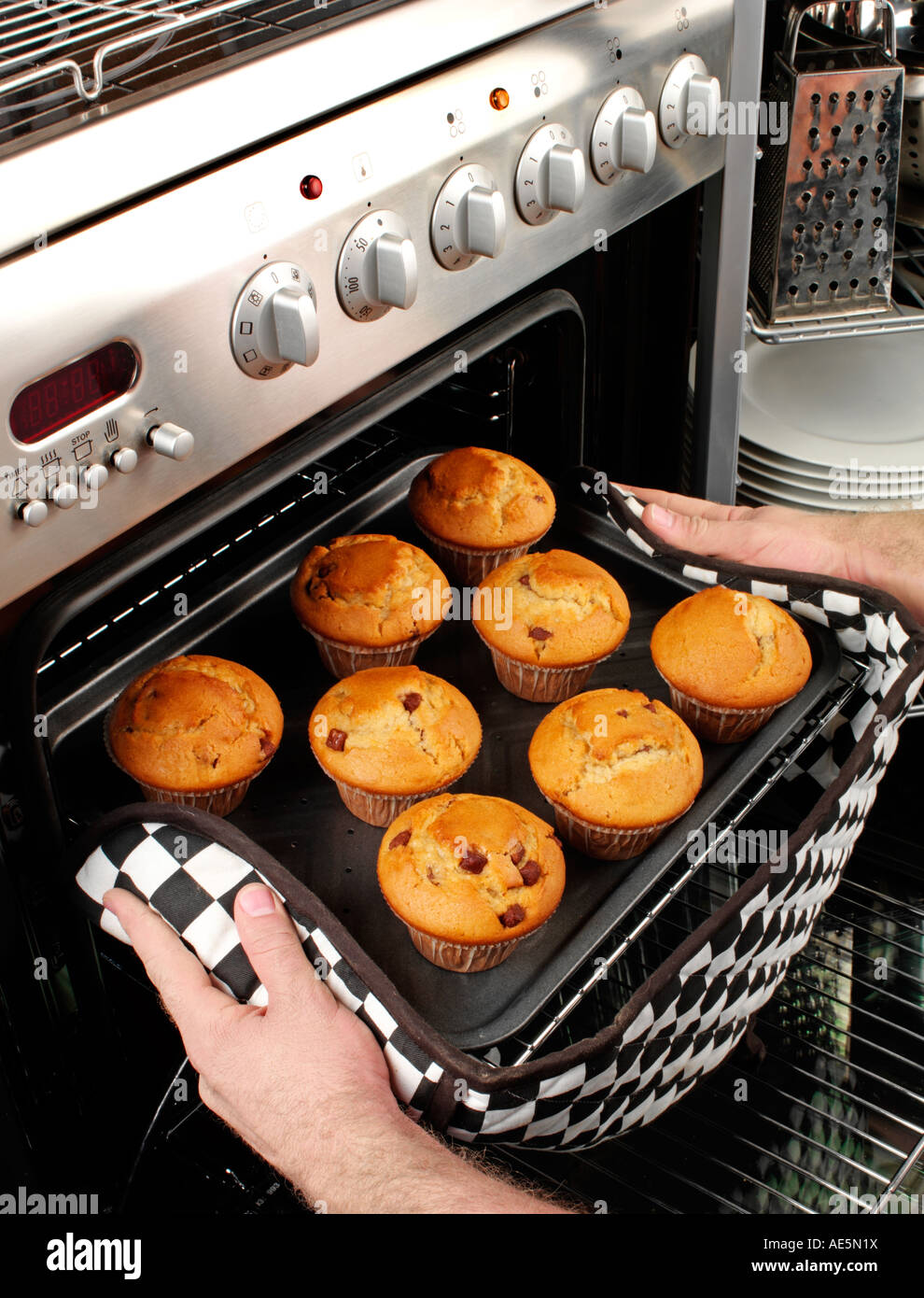 MAN BAKING MUFFINS Stock Photo - Alamy