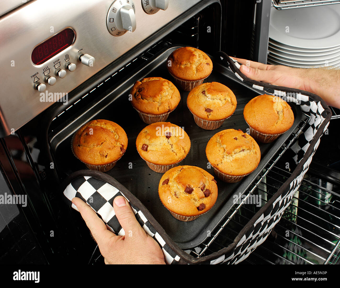 MAN BAKING MUFFINS Stock Photo - Alamy