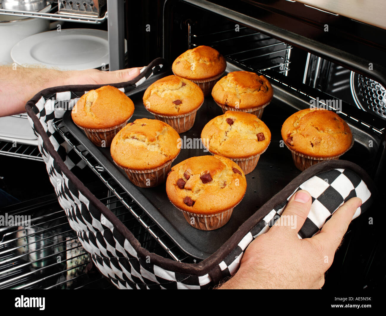 MAN BAKING MUFFINS Stock Photo - Alamy