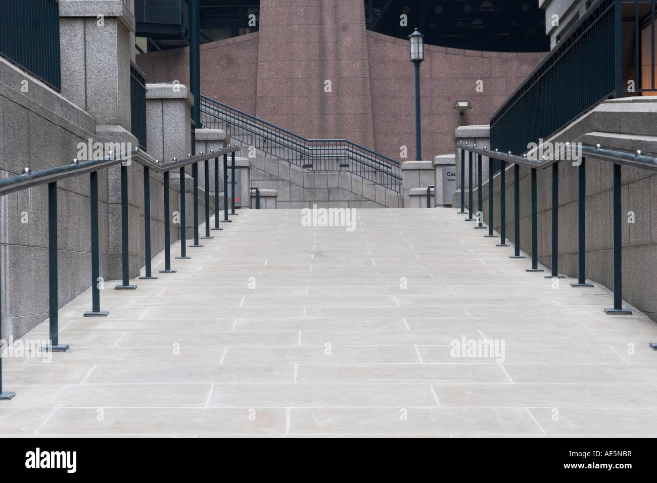 Clean architectural design of a concrete brick ramp with metal ...
