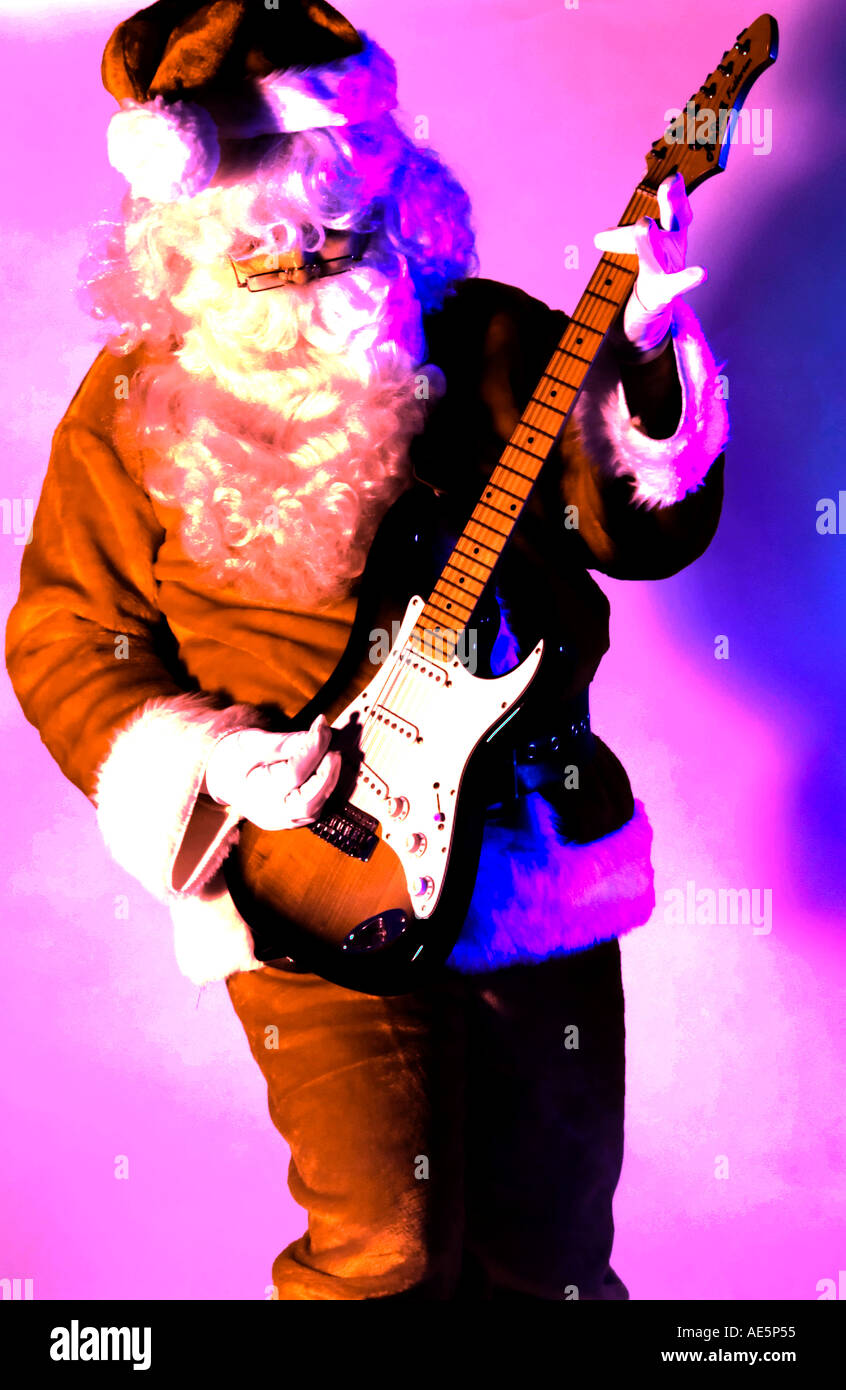 Santa playing guitar Stock Photo - Alamy
