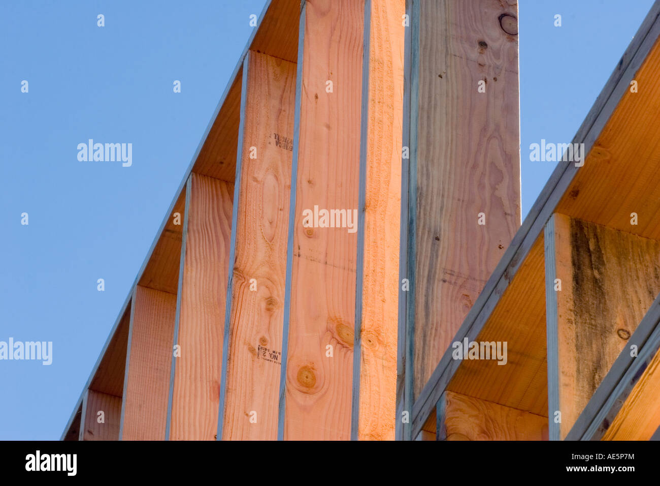 Structure of a framed wall at a construction site showing wood studs ...