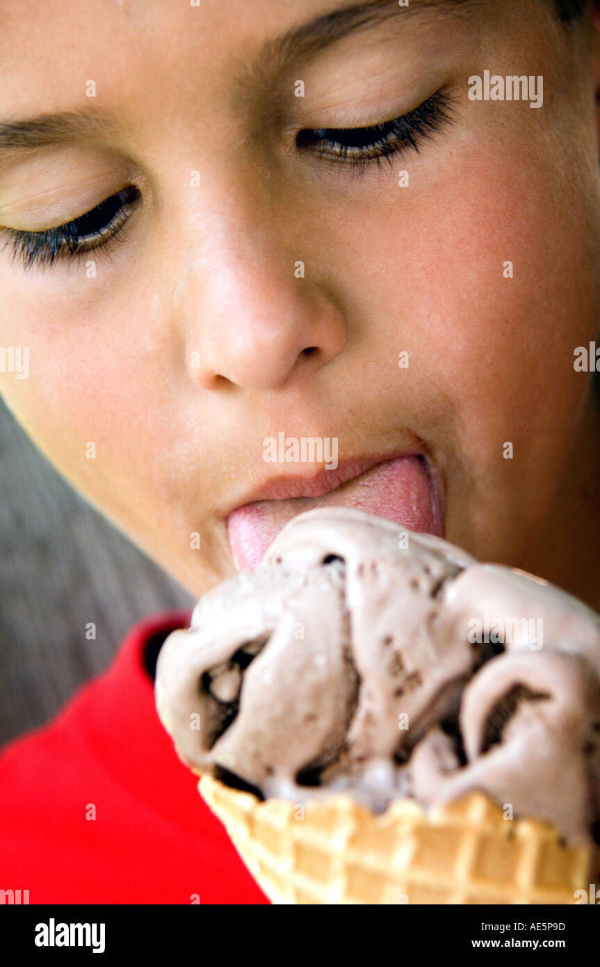 Boy eating ice cream cone Stock Photo - Alamy