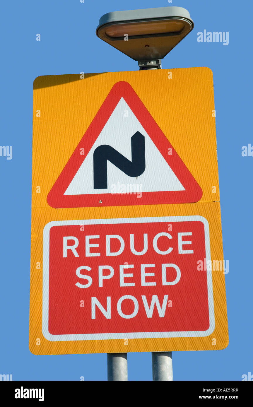 Reduce Speed Now Sign Stock Photo - Alamy