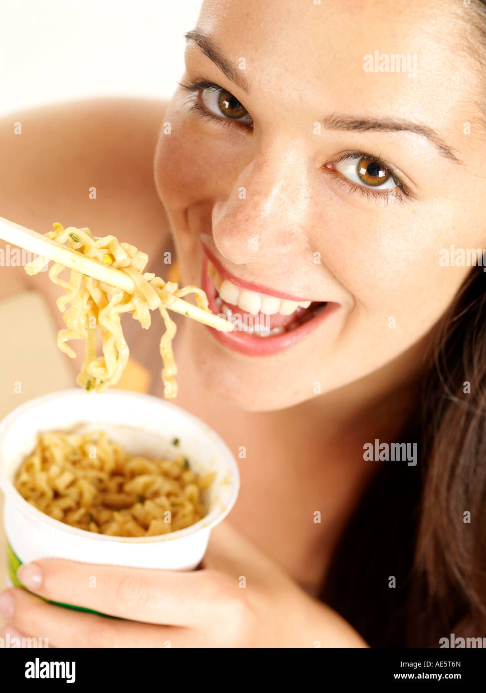Young Woman Eating Instant Noodles Model Released Stock Photo - Alamy