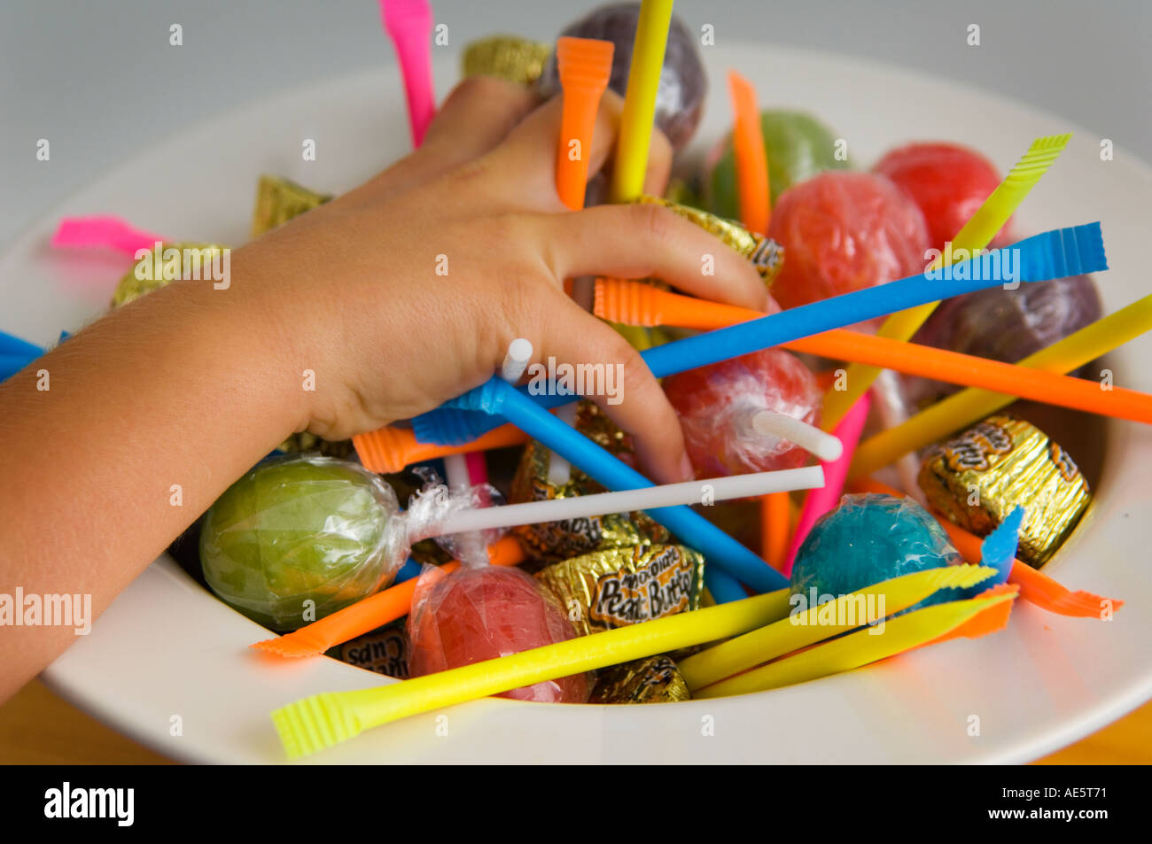 Kid grabbing Halloween candy Stock Photo - Alamy