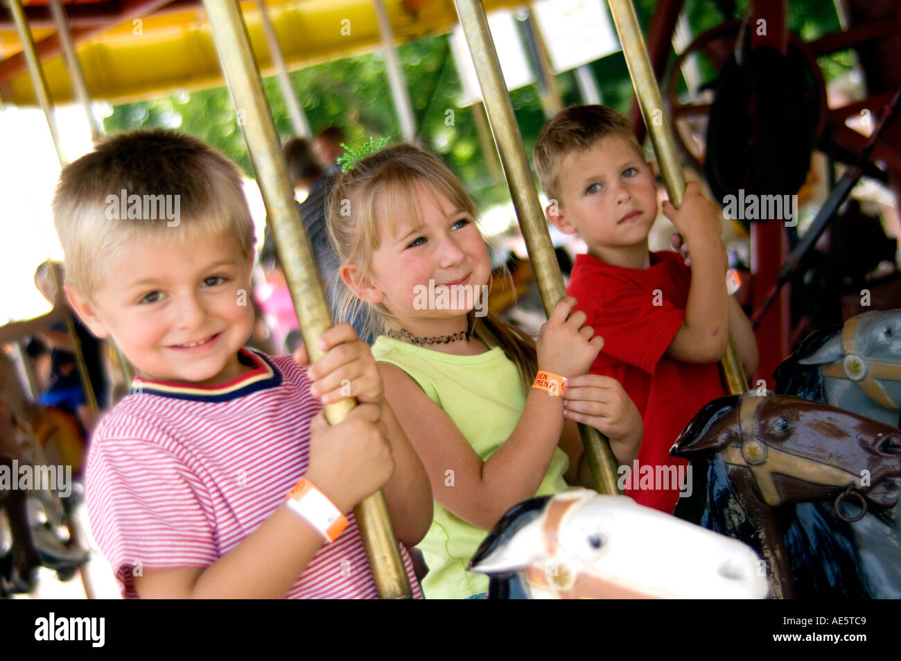 Girl riding on merry go round hi-res stock photography and images - Alamy