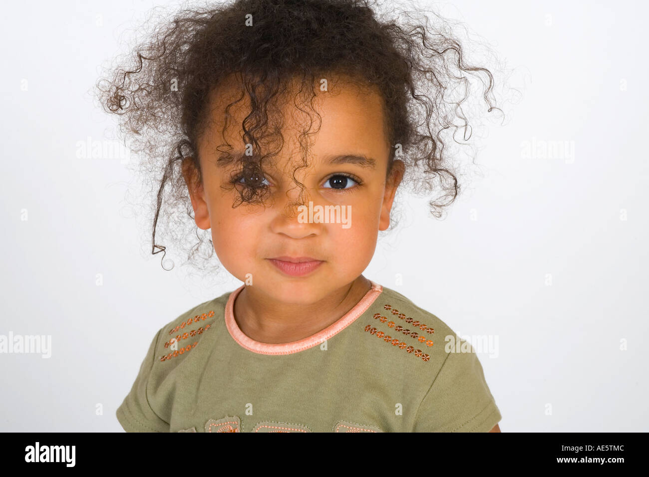 A beautiful mixed race girl with curly hair and a smiley face Stock ...