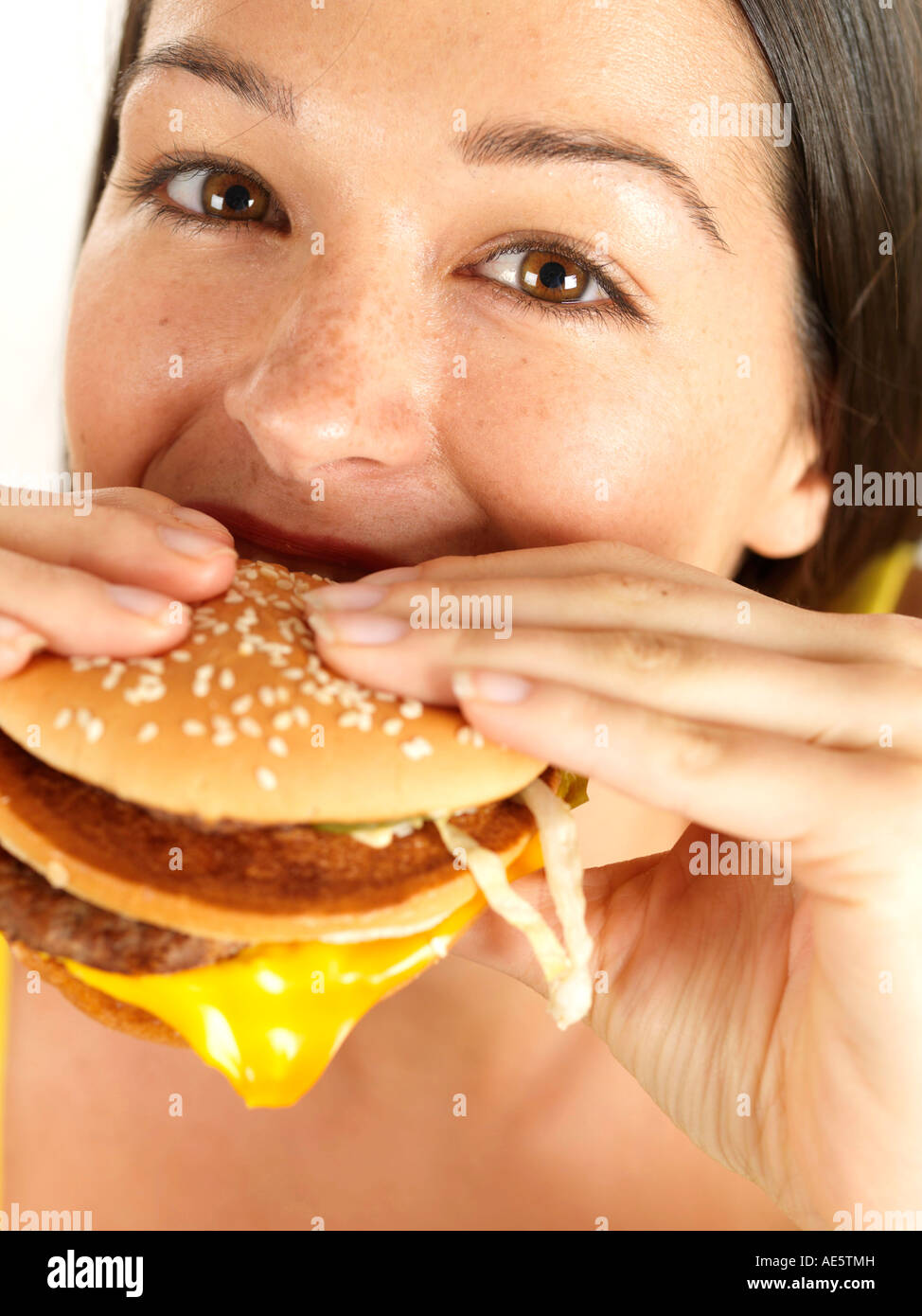 Young Woman Eating Hamburger Model Released Stock Photo - Alamy