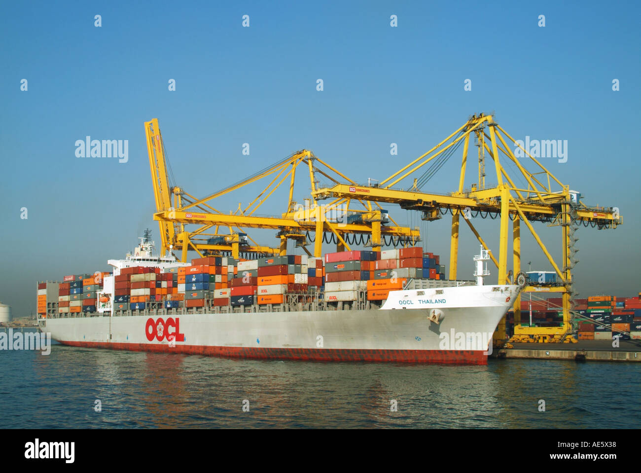 Barcelona port installations with "OOCL Thailand" container ship moored ...
